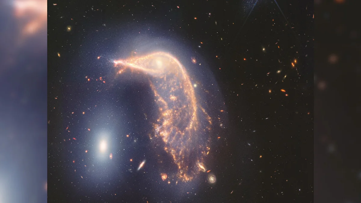 Merging galaxies look like 'Penguin and Egg' in new image from JWST - The Weather Network