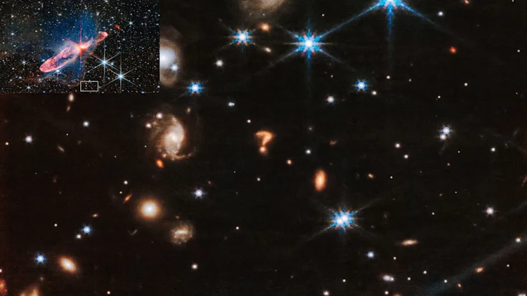 Webb spots a 'cosmic question mark' while peering at rambunctious young ...