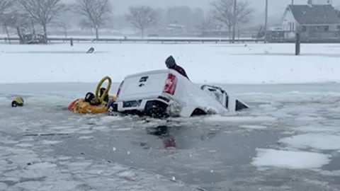 Rescuers brave cracking ice to pull two from sinking truck - The ...