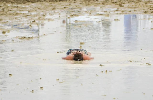 Burning Man festival road reopens, allowing thousands to escape muddy ...