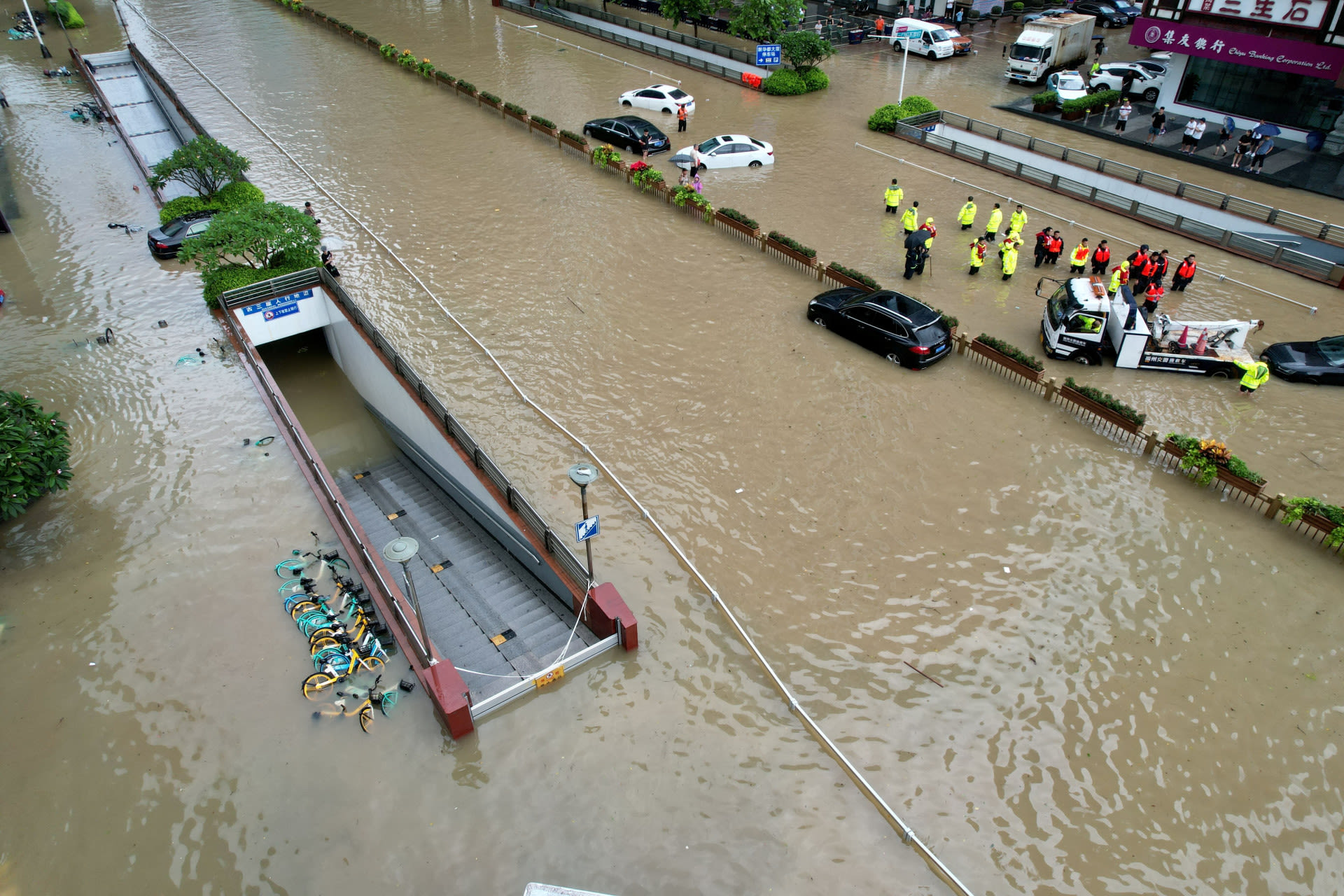 Typhoon turns roads into rivers, kills at least two in Beijing - The ...