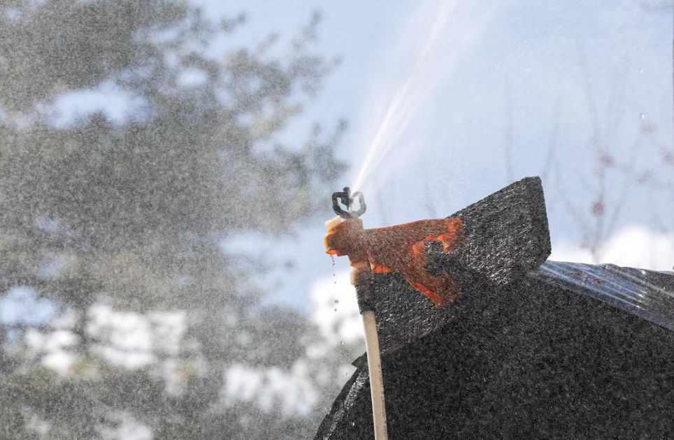 'Wall of water': How sprinklers are saving homes from wildfires - The ...