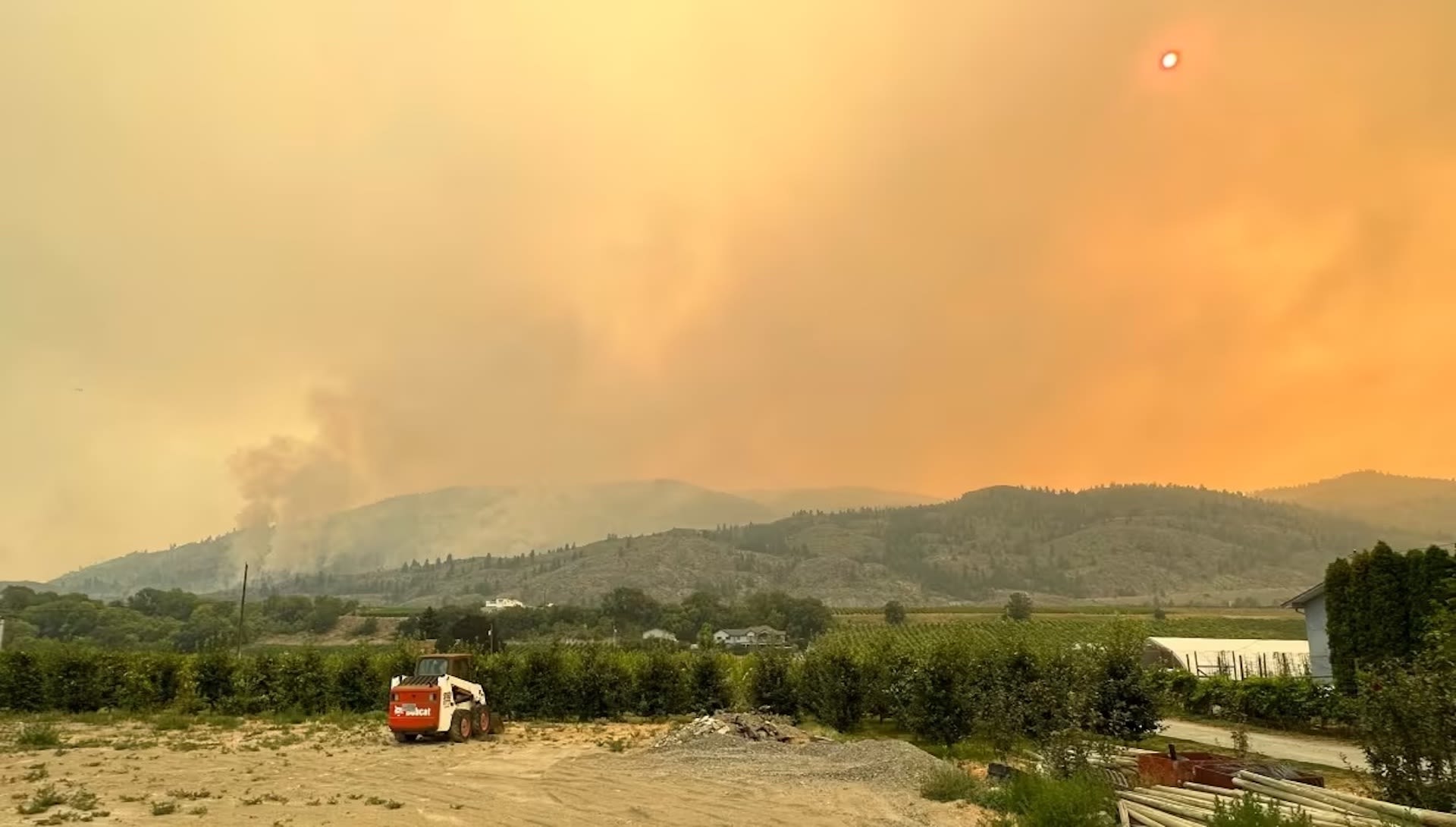 Some relief as evacuation order reduced for wildfire burning near ...